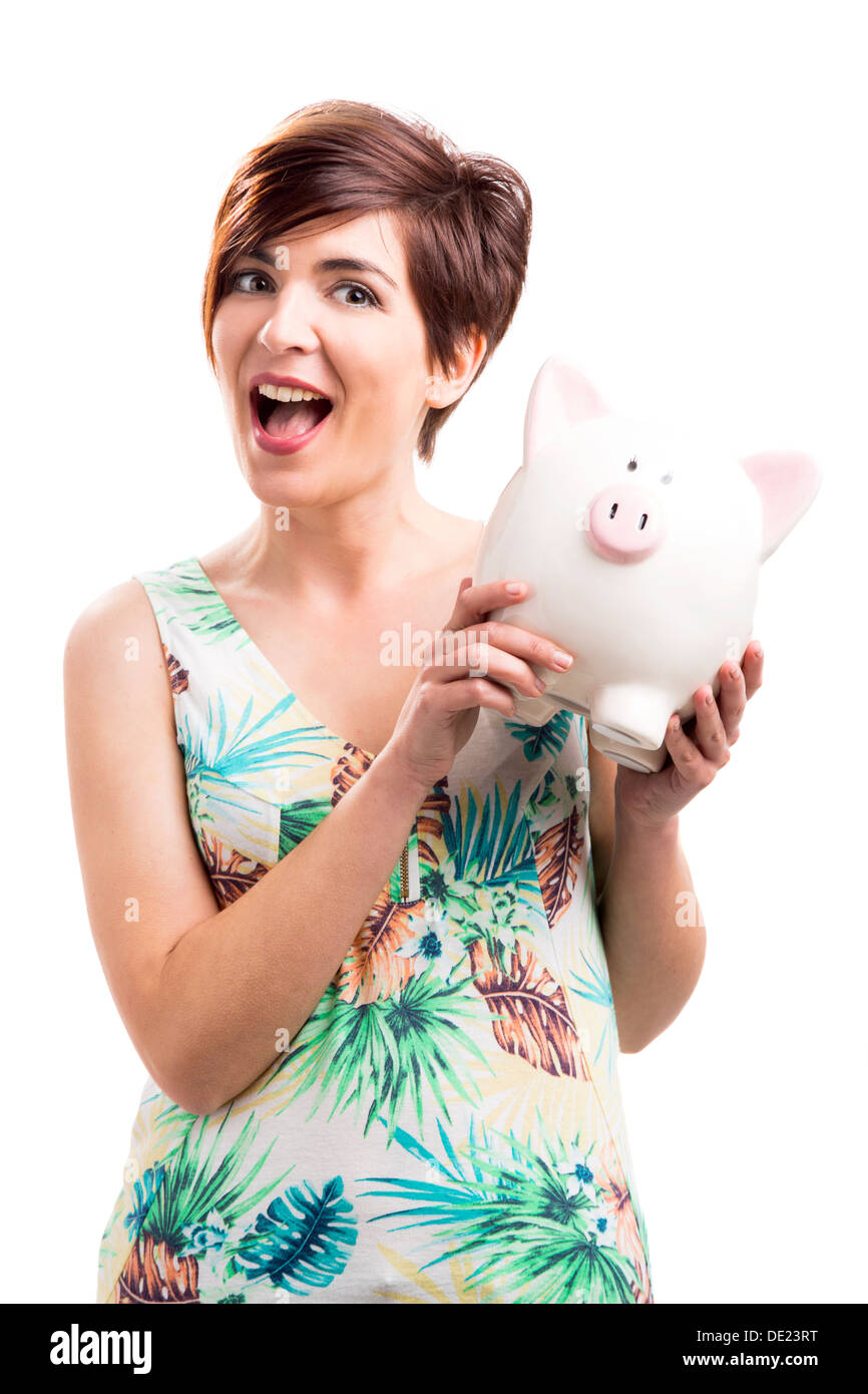 Admired woman with a piggy bank, isolated over a white background Stock ...