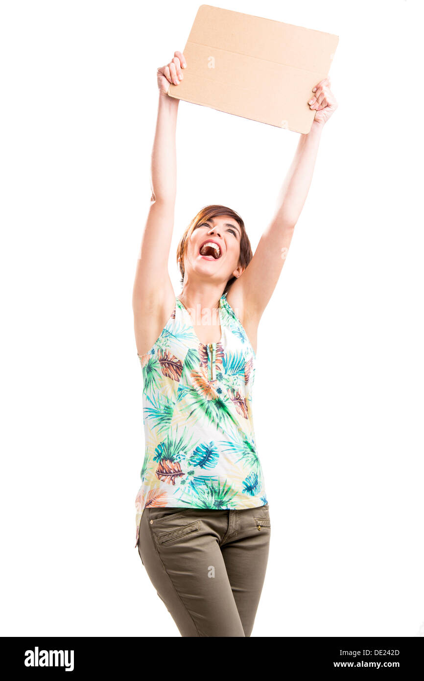Beautiful and happy woman holding a cardboard, isolated over a white ...
