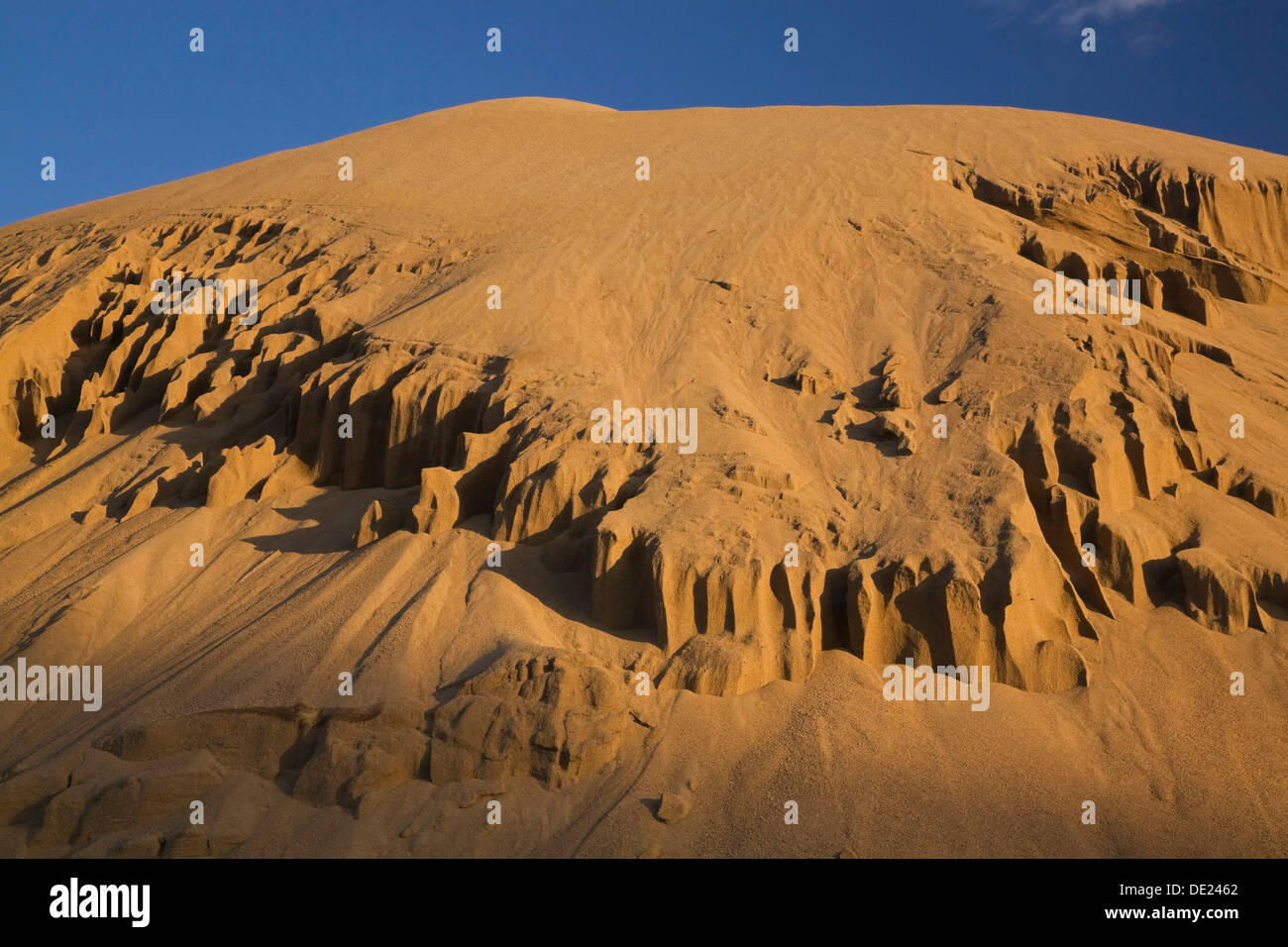 Mound of sand in a commercial sandpit hi-res stock photography and ...
