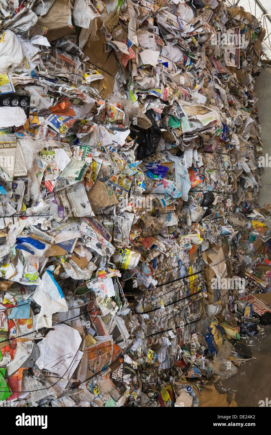 Stacked bales of recyclable cardboard and paper at a sorting centre ...