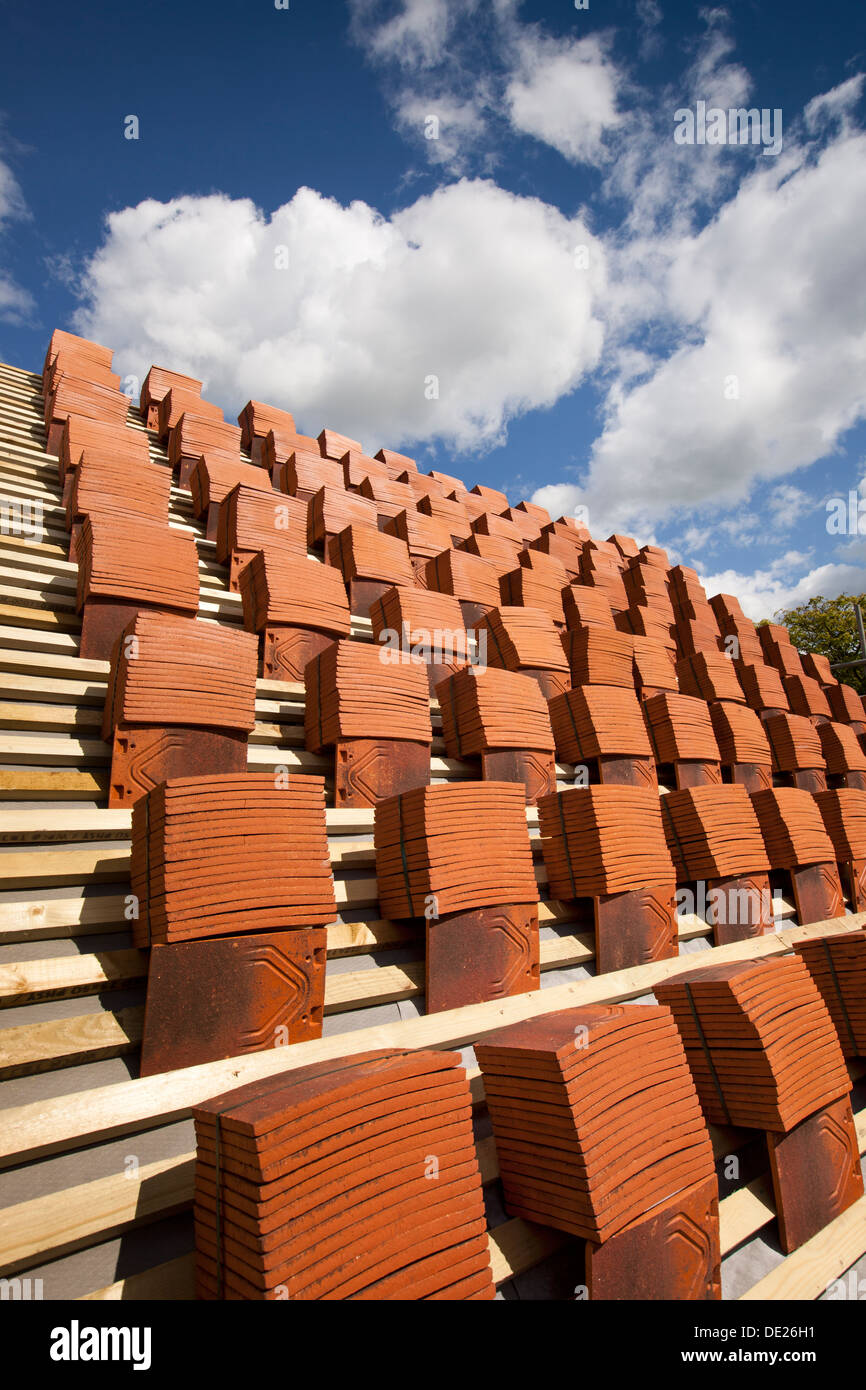 self building house, roofing, piles of traditional clay roof tiles ...