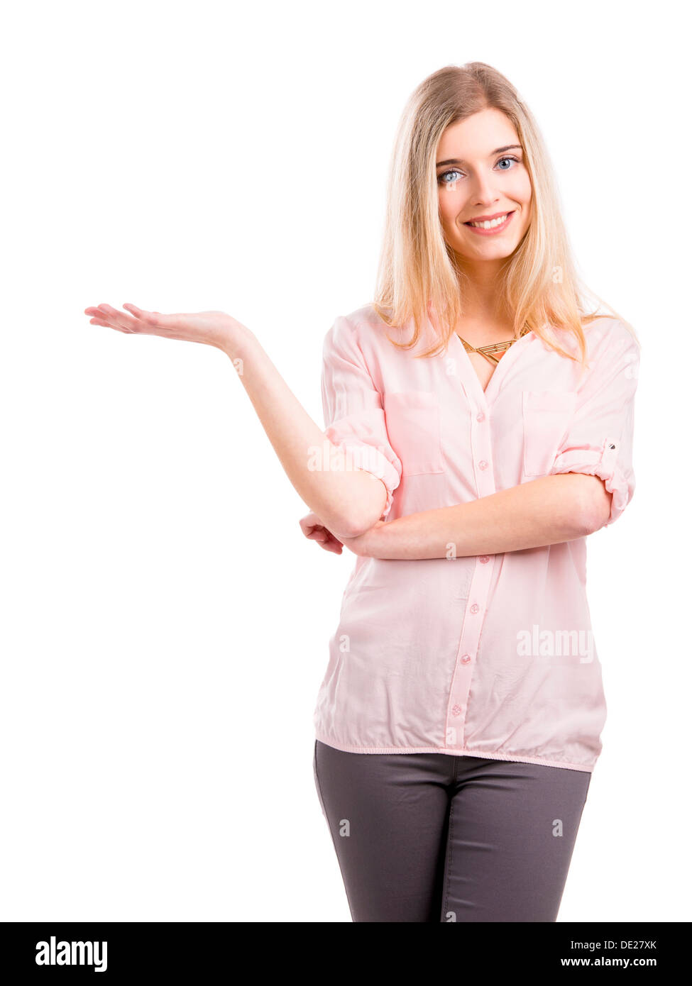 Beautiful young woman smiling and showing the palm of her right hand ...