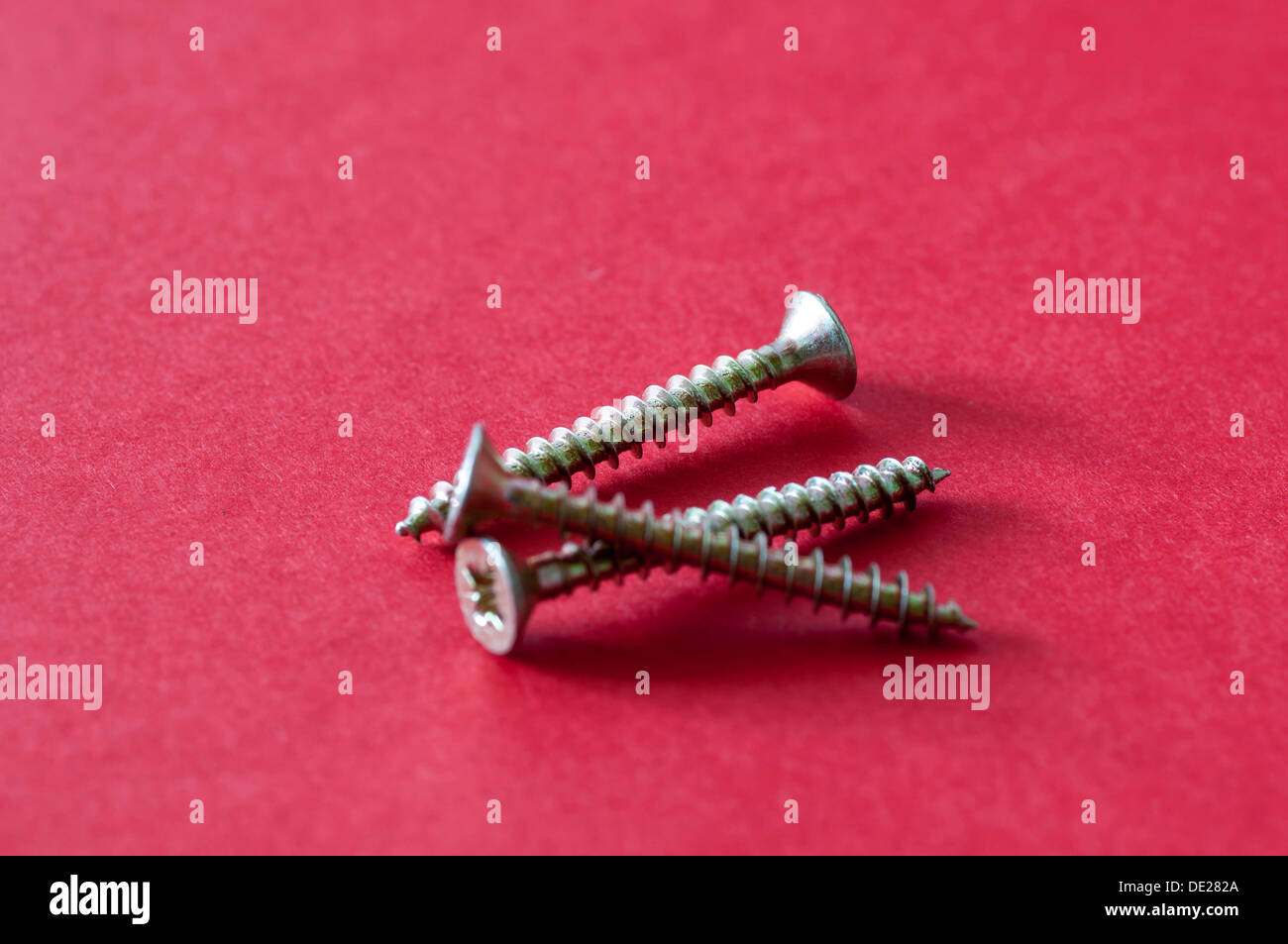 Three wood screws Stock Photo - Alamy