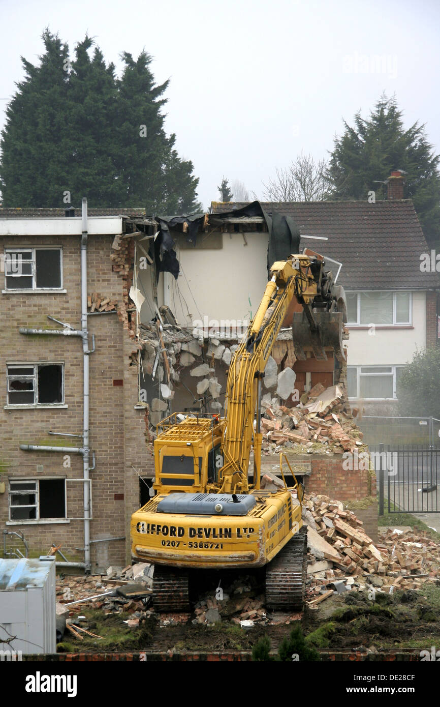 The Demolition of a Small block of Flats using an excavator Stock Photo ...