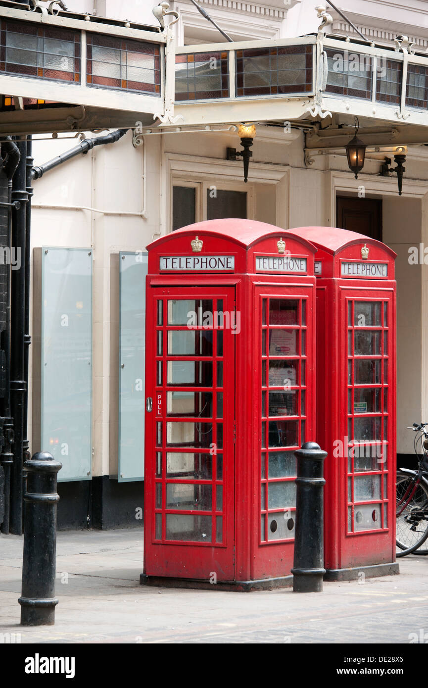 two red phone boxes in Soho Stock Photo - Alamy