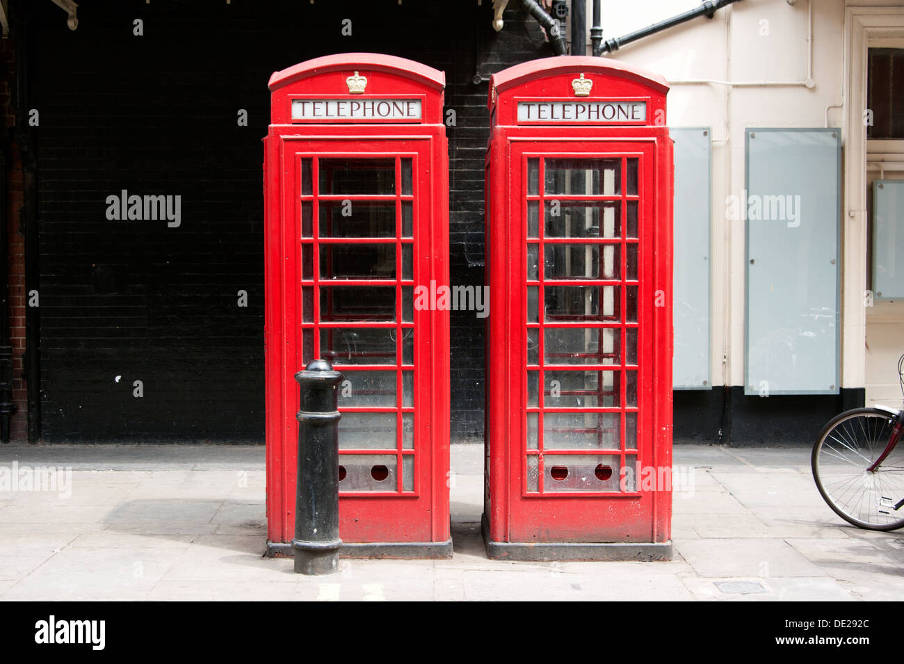 two red phone boxes in Soho Stock Photo - Alamy