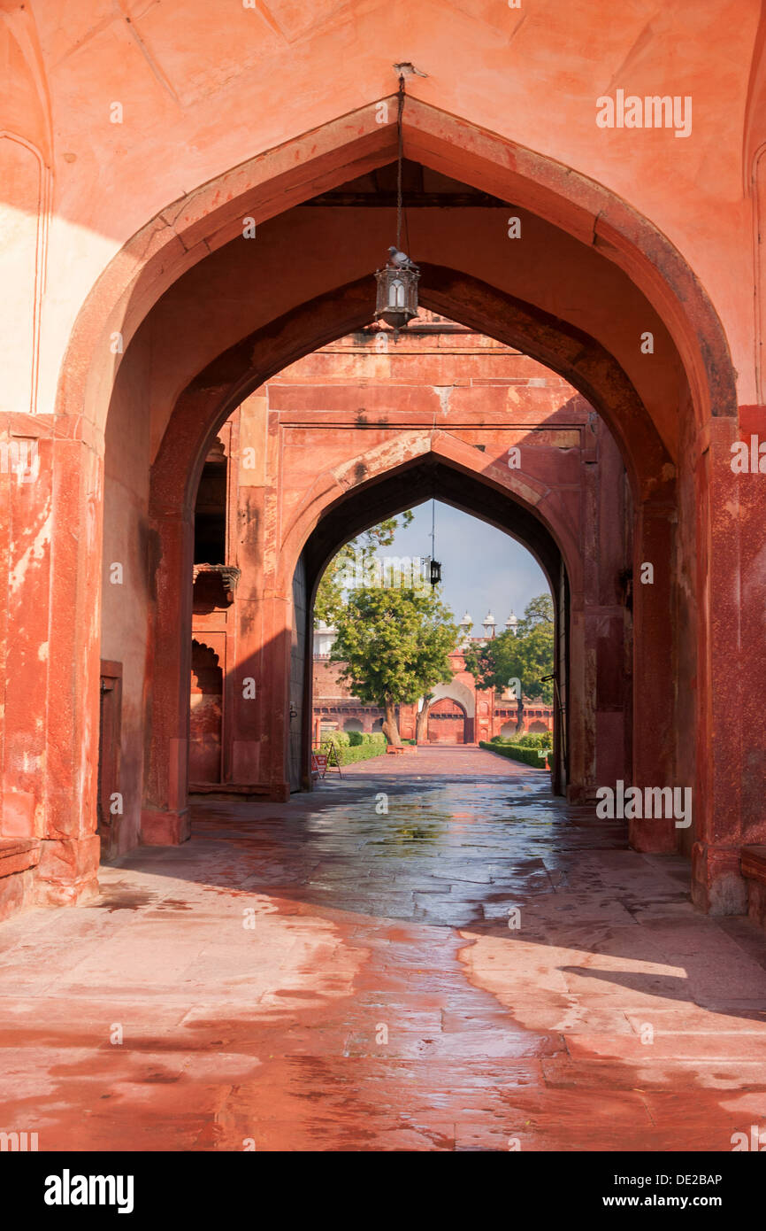 Looking through double red gates at Agra's Fort in India Stock Photo ...