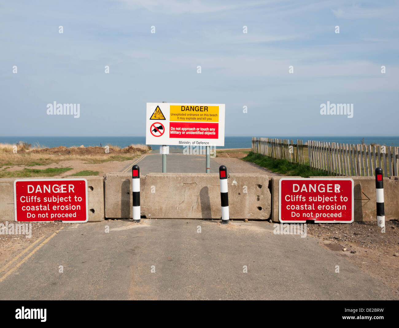 Warning signs on a road closed by coastal erosion East Yorkshire ...