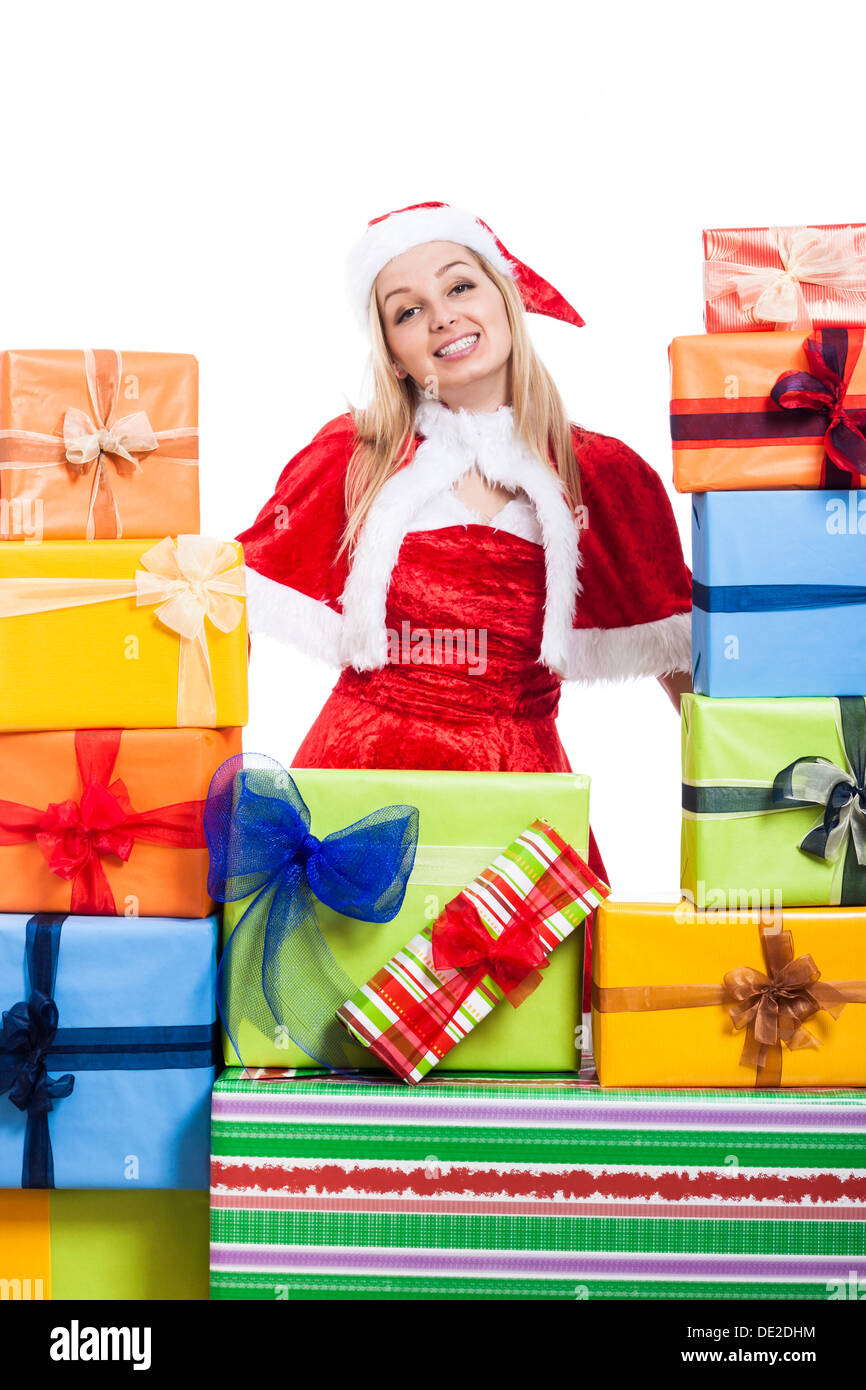 Excited Christmas woman surrounded by presents, isolated on white ...