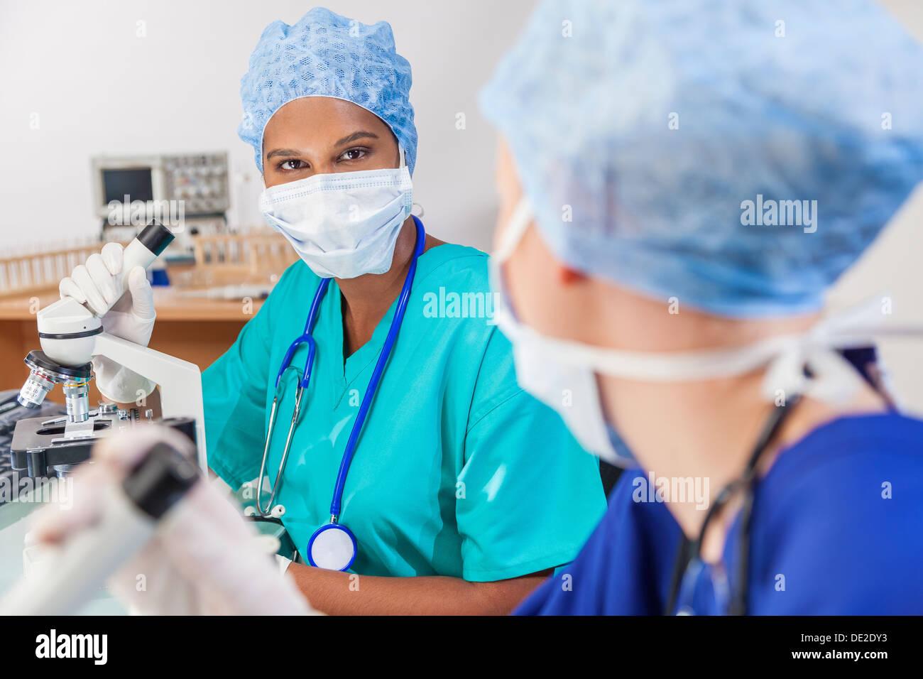 Indian doctor with microscope hi-res stock photography and images - Alamy