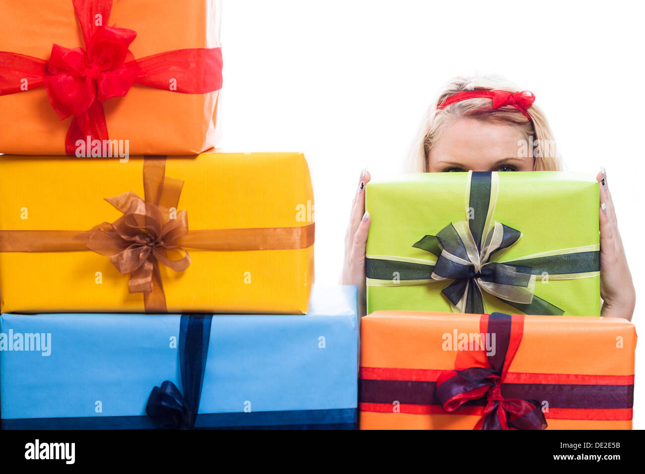 Secret woman hiding behind many presents, isolated on white background ...