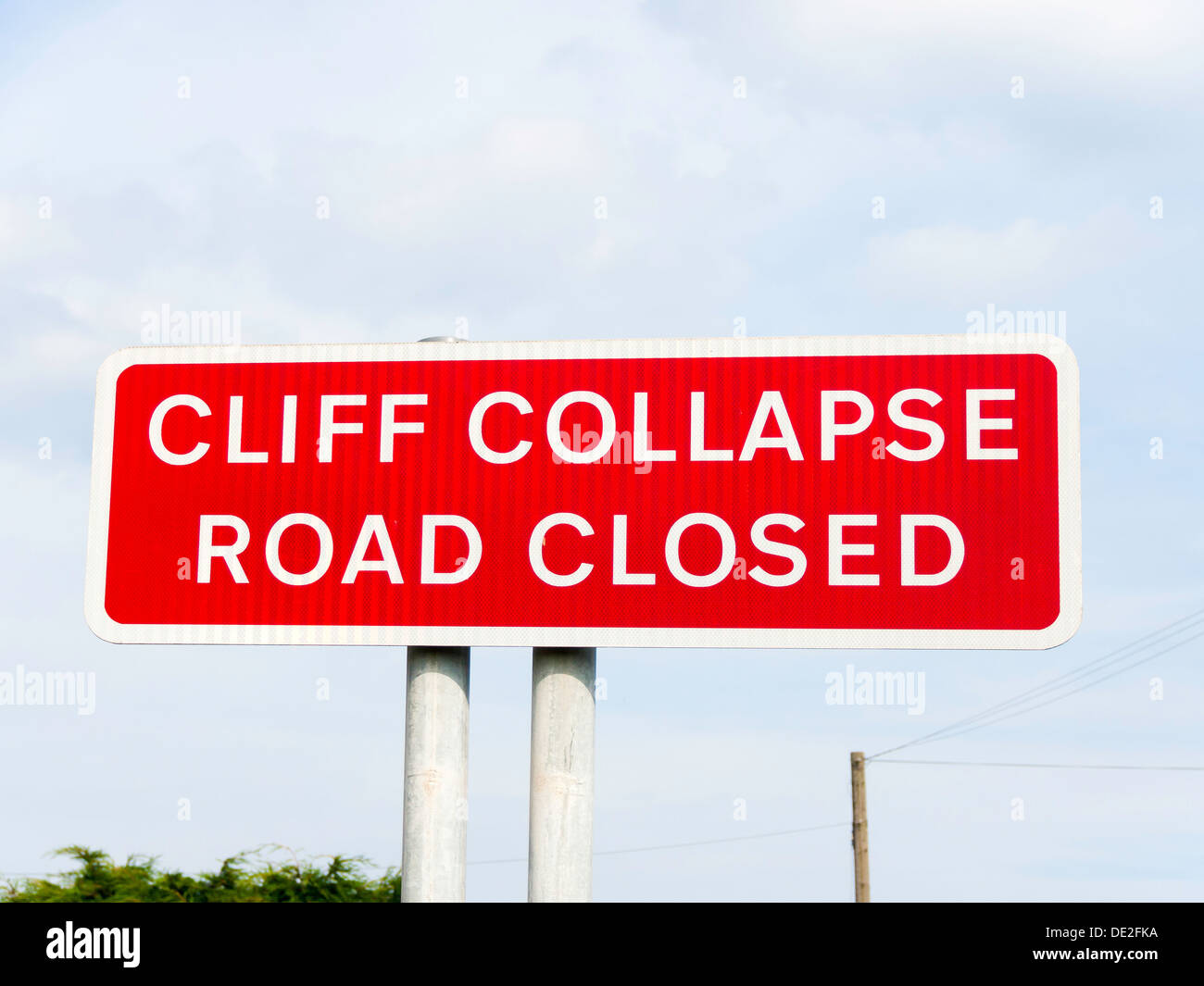 Warning sign "Cliff Collapse Road Closed" risk of falling Stock Photo ...