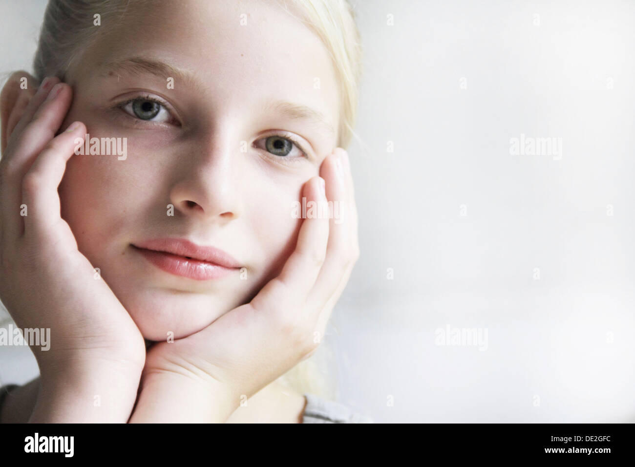 Girl supporting head hands hi-res stock photography and images - Alamy