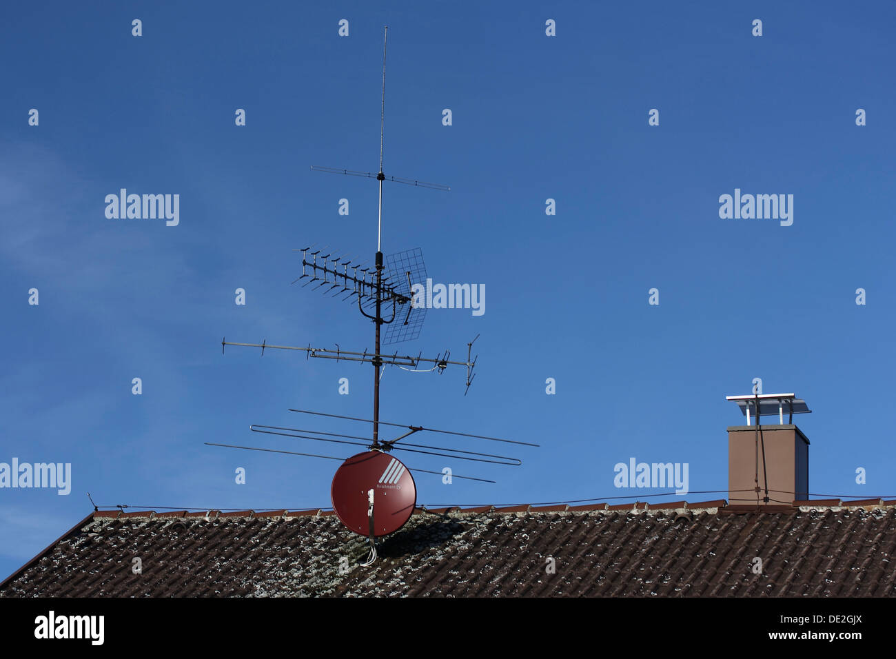 Satellite dish on a roof Stock Photo - Alamy