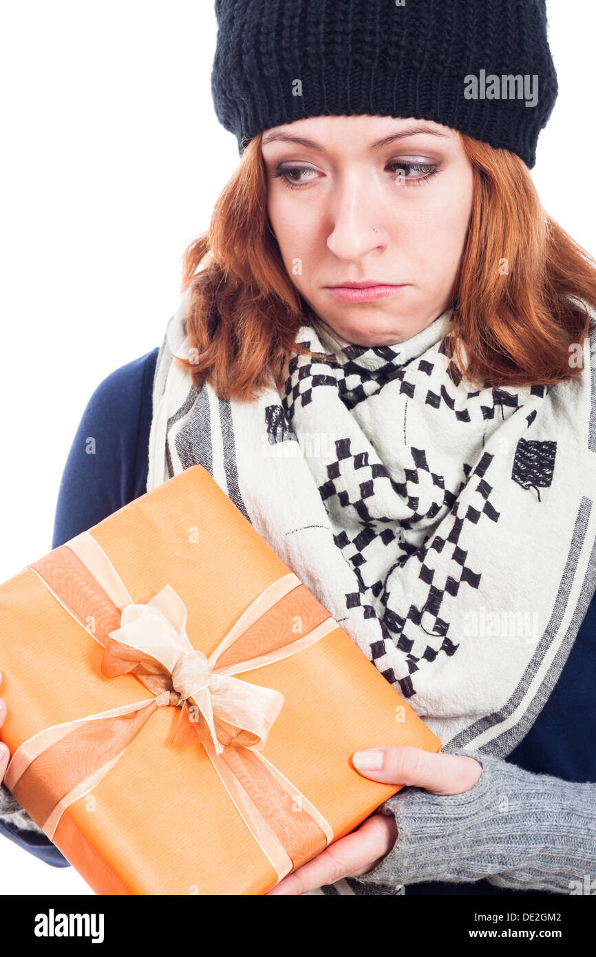 Closeup of unhappy sad woman holding present Stock Photo - Alamy