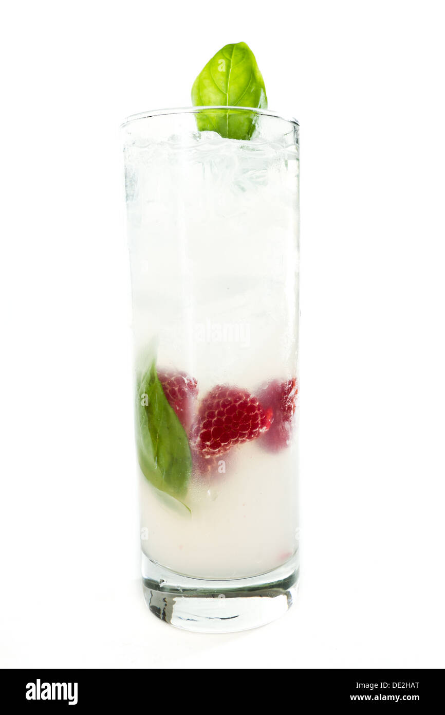 raspberry and basil cocktail served in a tall glass isolated on a white ...