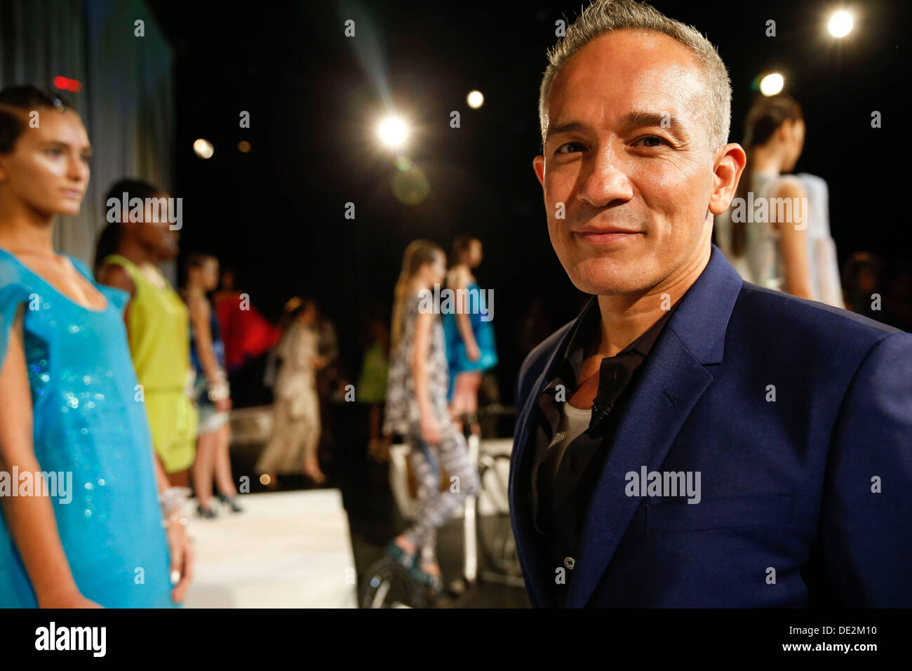 New York, NY, USA. 9th Sept, 2013. Cesar Galindo stands with models ...