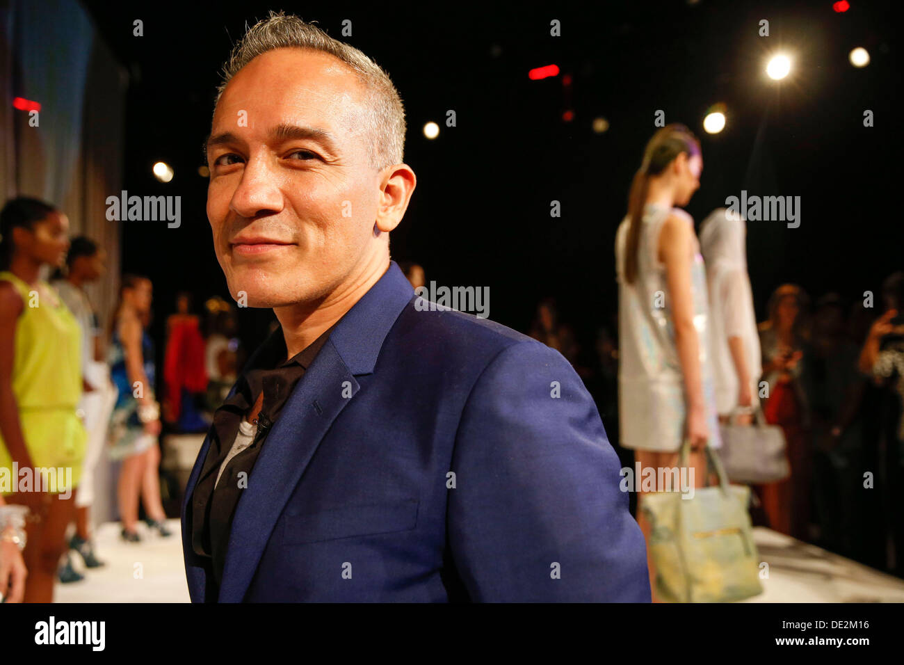New York, NY, USA. 9th Sept, 2013. Cesar Galindo stands with models ...