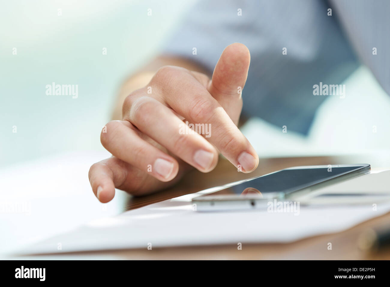 Human hand operating a smartphone gadget Stock Photo - Alamy