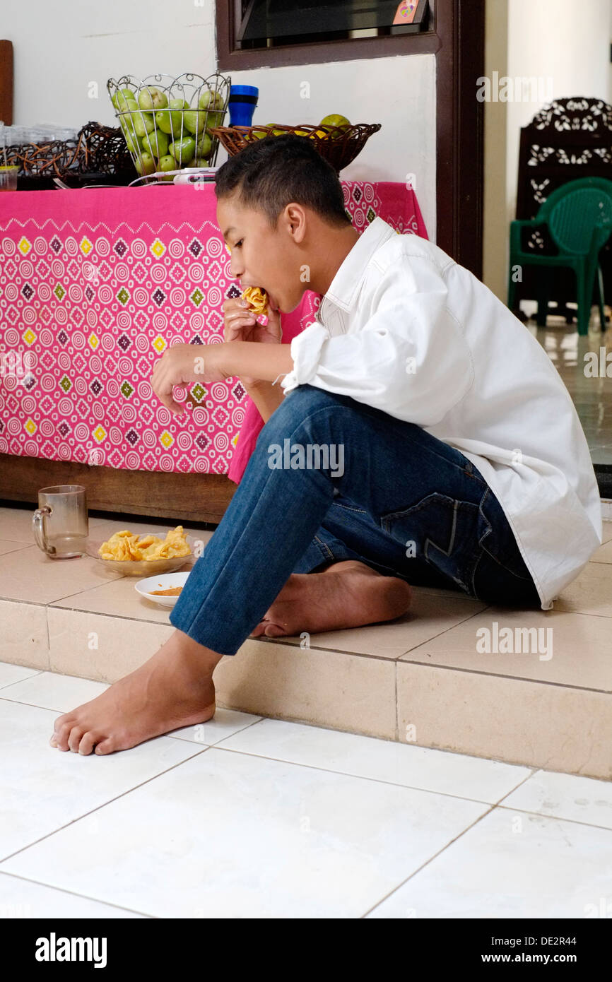 young man eating a simple meal at his home in java indonesia Stock ...