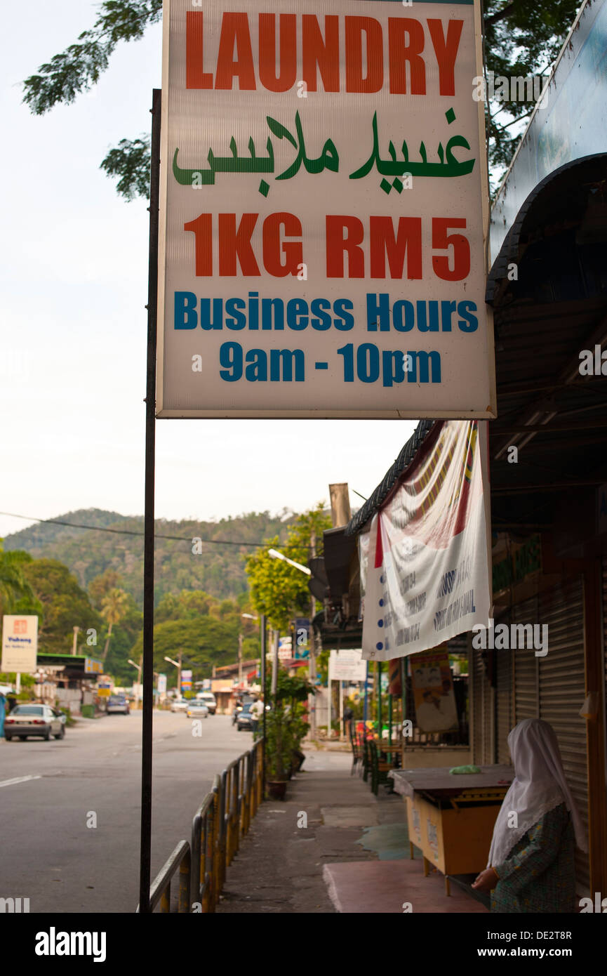 Laundry by the kilo, sign, Malaysia Stock Photo - Alamy