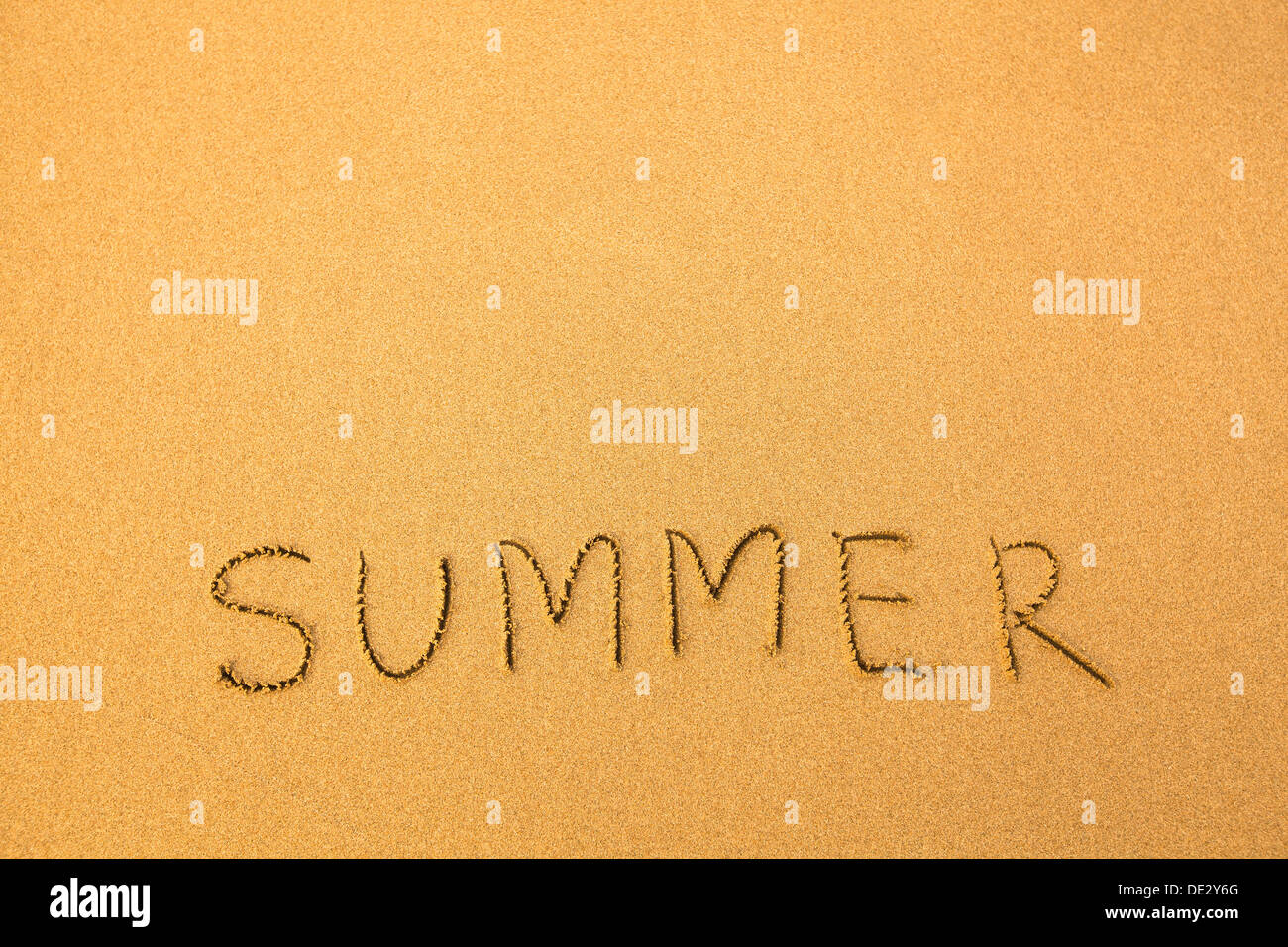Summer, text written by hand in sand on a beach Stock Photo - Alamy