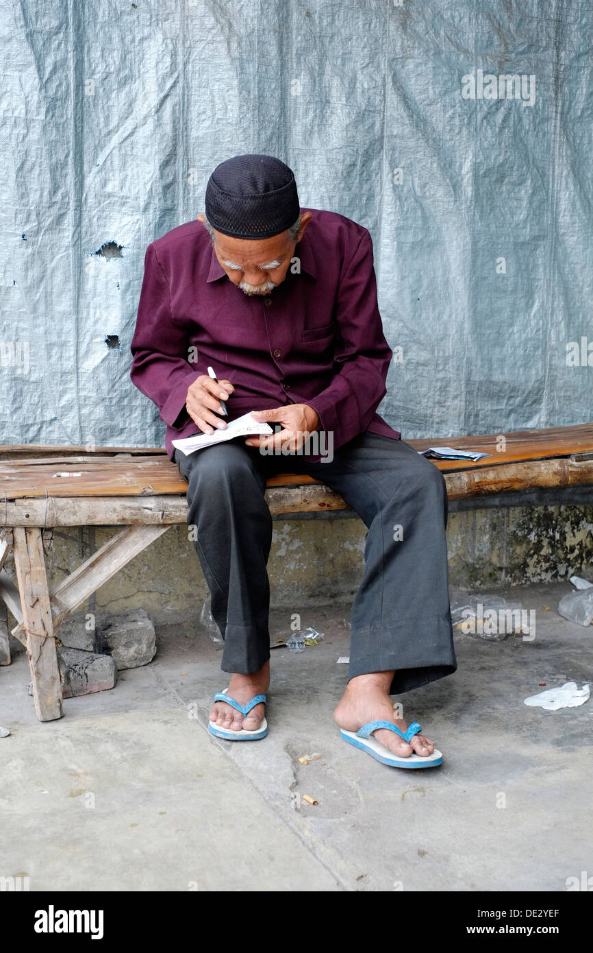 Seated writing man hi-res stock photography and images - Alamy