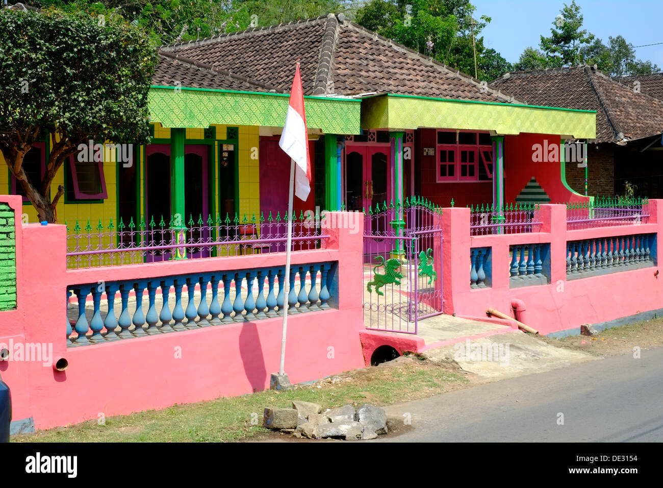 brightly painted house in a variety of colours in a small village in ...