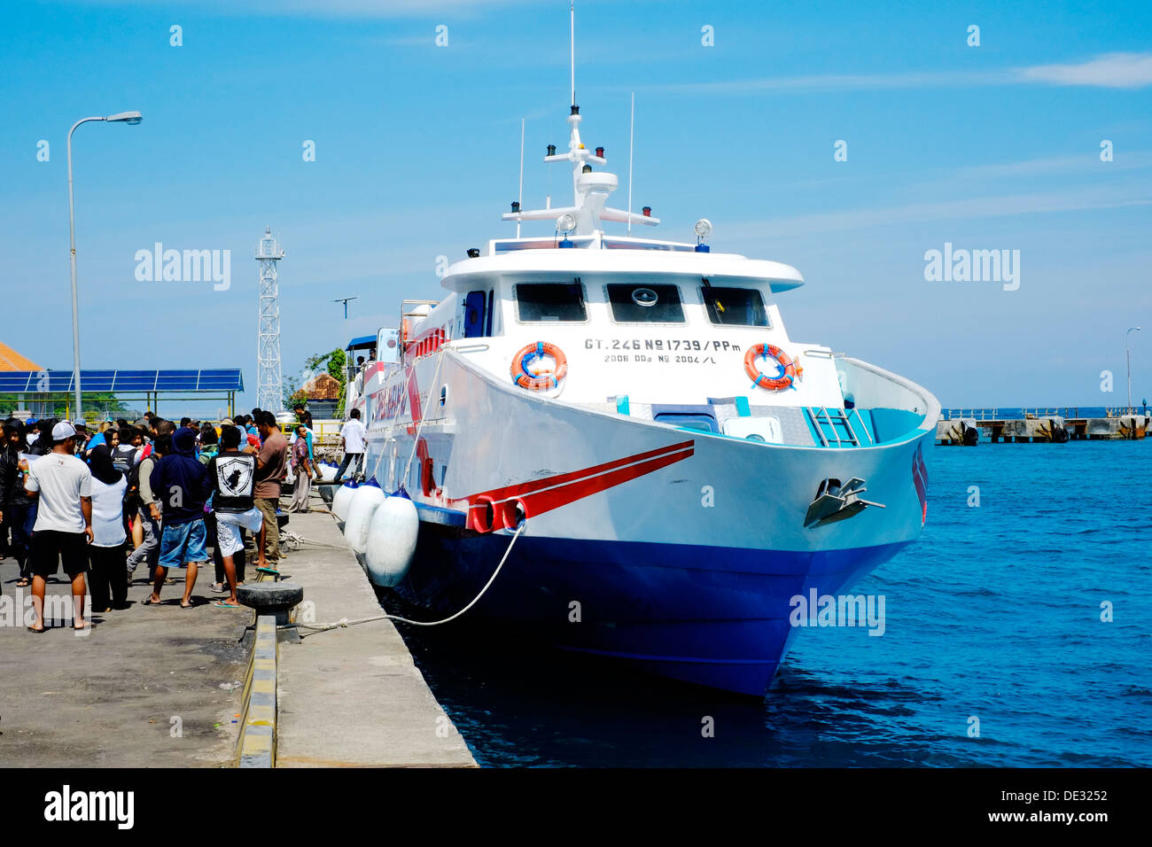 passengers disembark from the express fast boat the bahari on ...