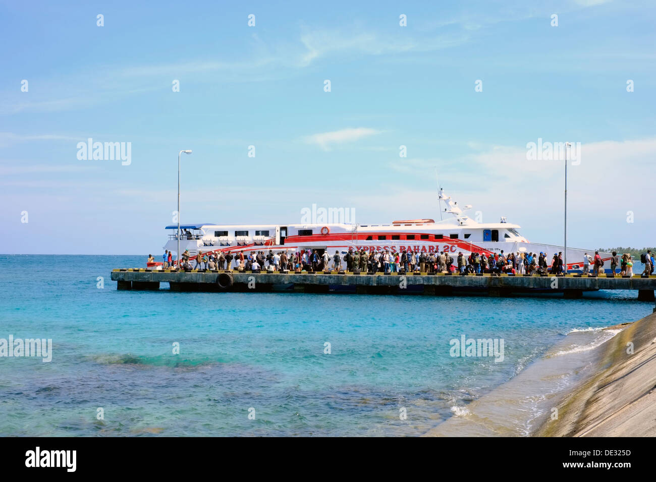 passengers disembark from the express fast boat the bahari on ...