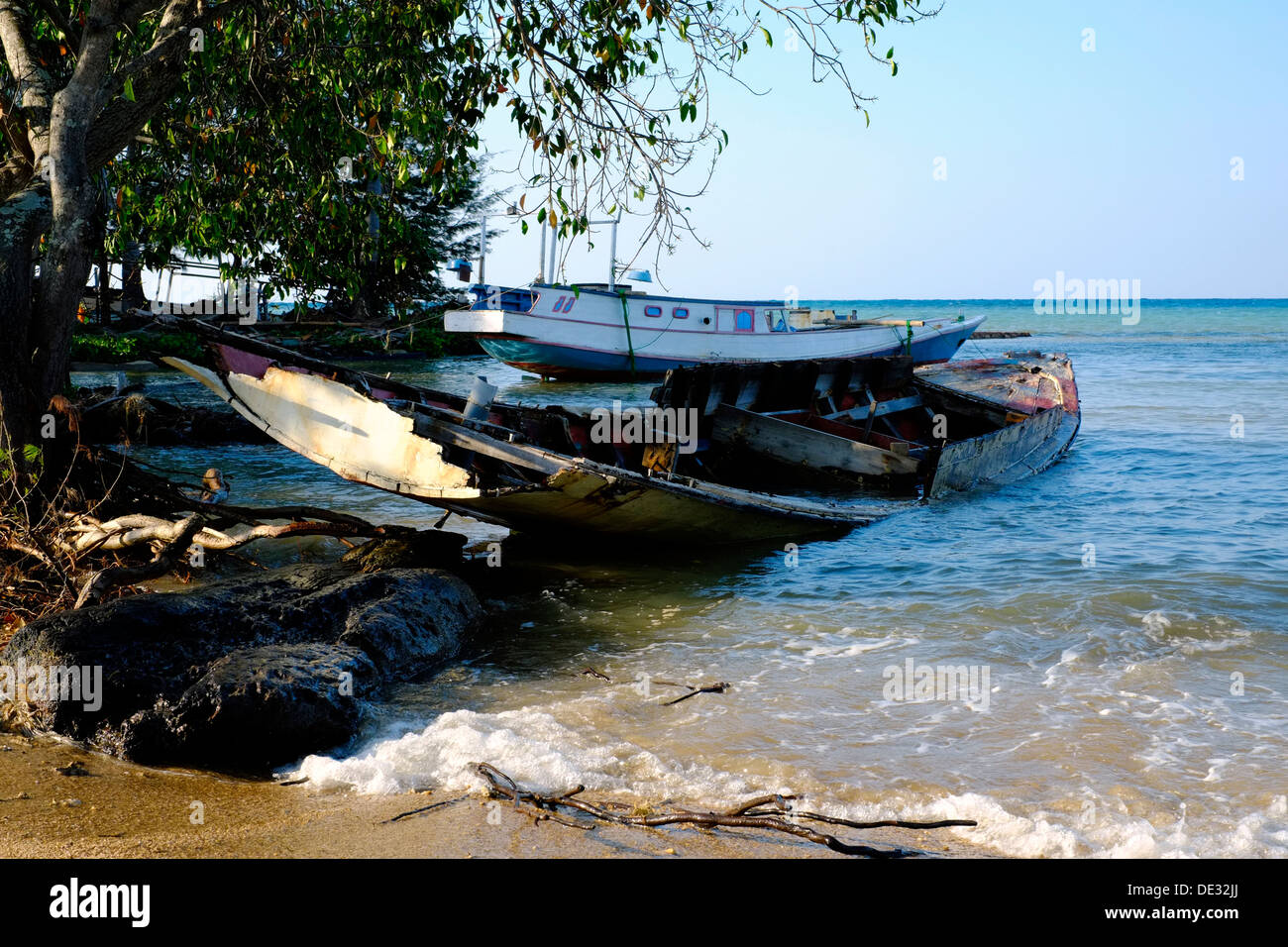 abandoned and derelict traditional fishing boat on a beach karimunjawa ...