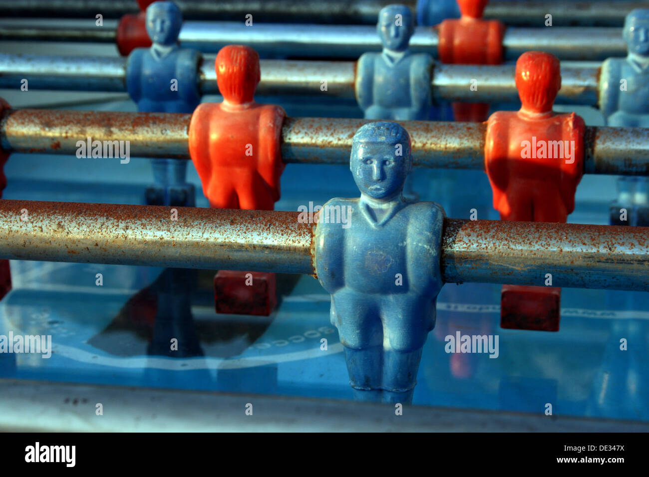 Tabletop foosball game with red and blue figures Stock Photo - Alamy