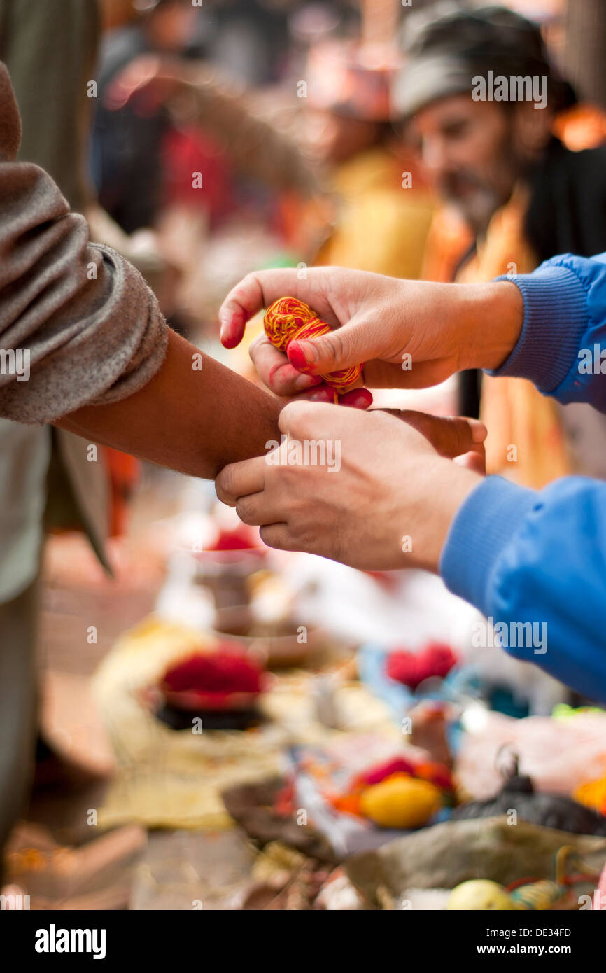 Bonding with Holy Thread Stock Photo - Alamy
