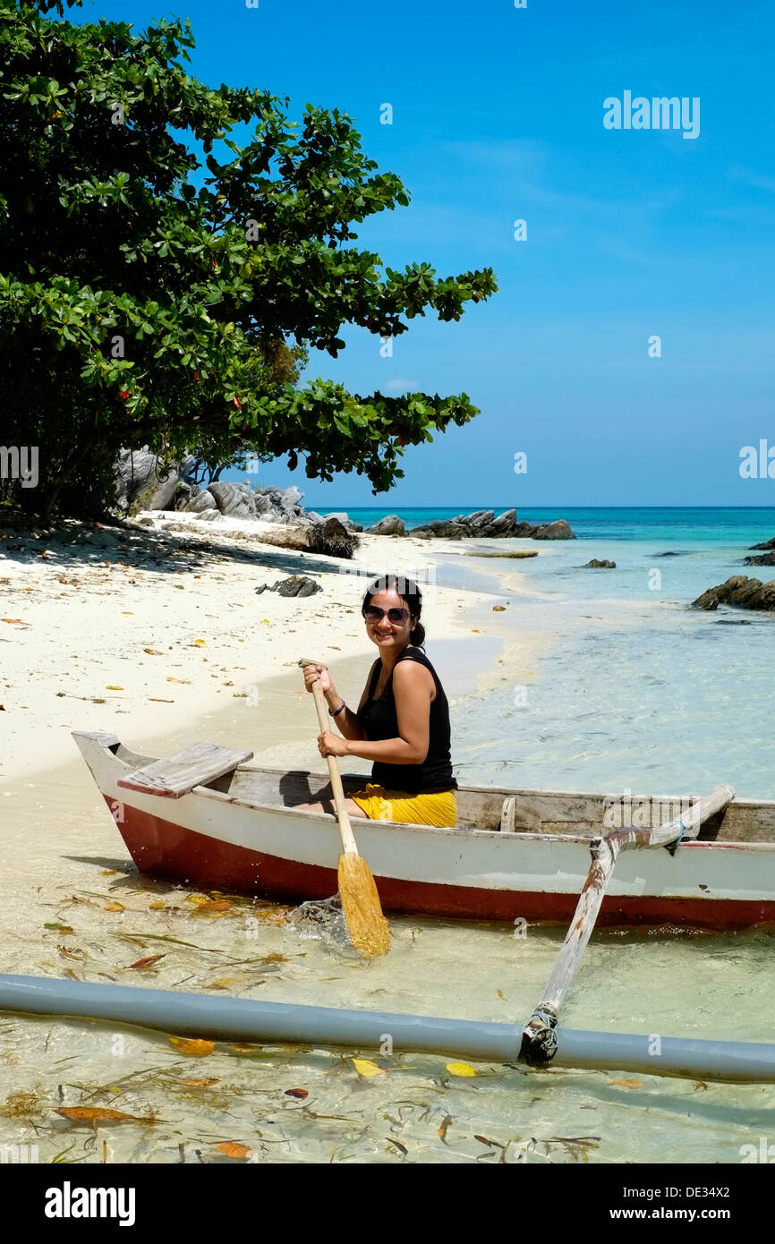 young local indonesian woman enjoying the pristine seas and beaches of ...