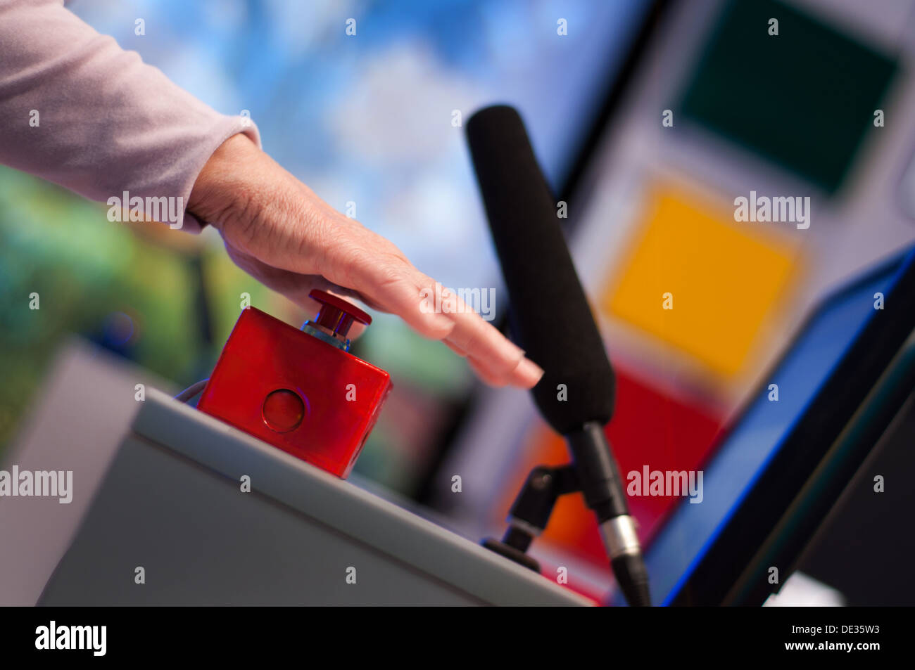 Hand pushing a red button Stock Photo - Alamy