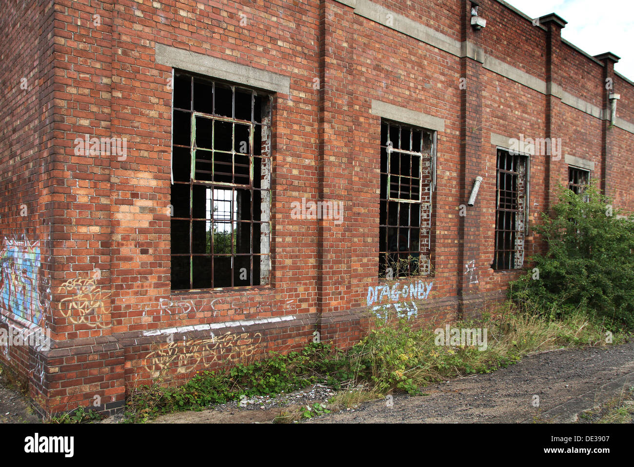 Outside of old derelict engineering building Stock Photo - Alamy