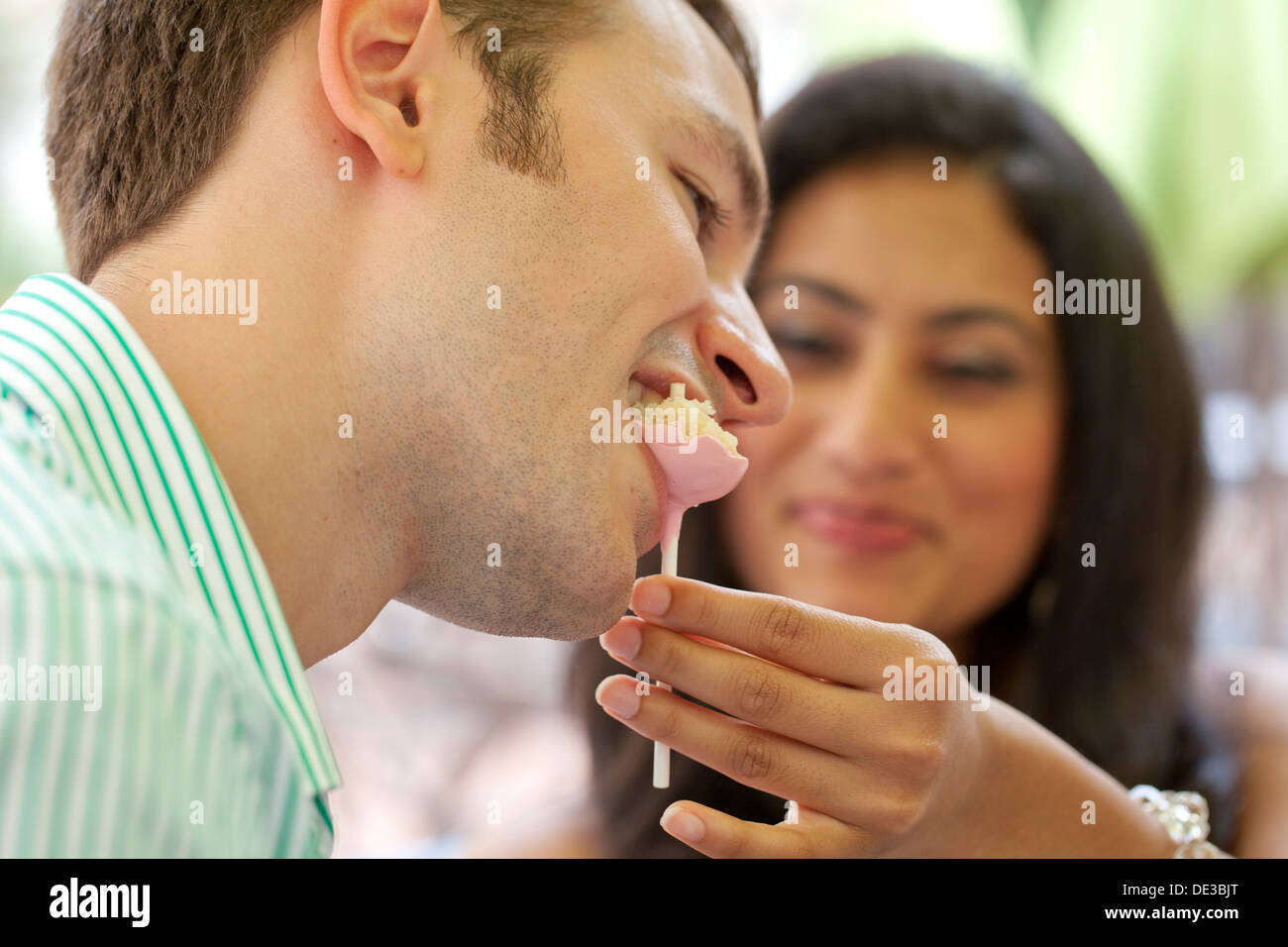 Feeding sweets hi-res stock photography and images - Alamy