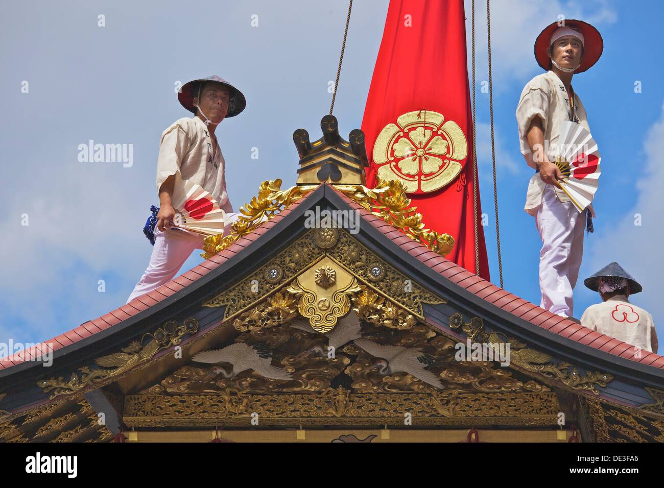 Roof riders on top of a float in the parade Stock Photo - Alamy
