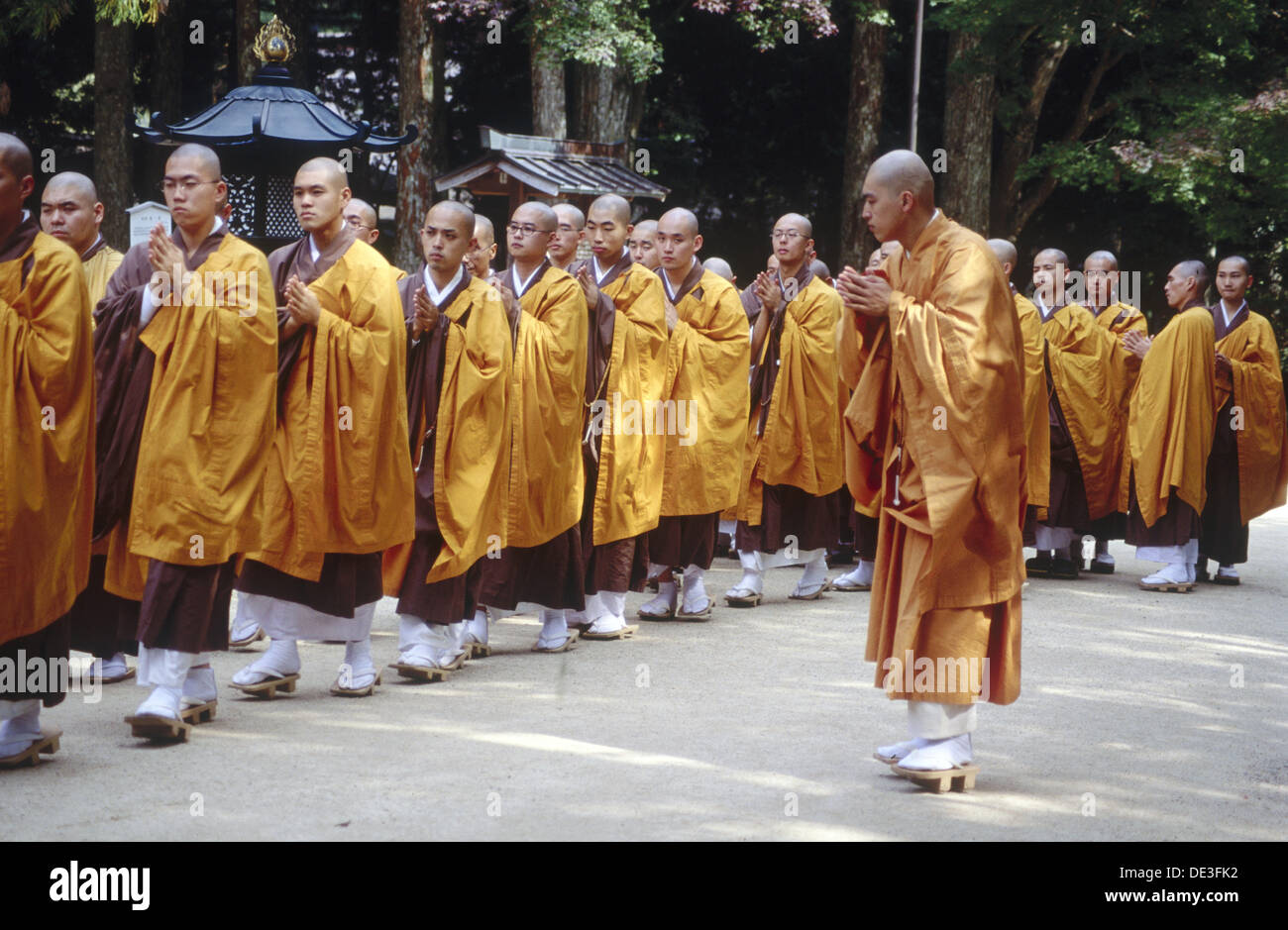 Young buddhist monk walking along hi-res stock photography and images ...