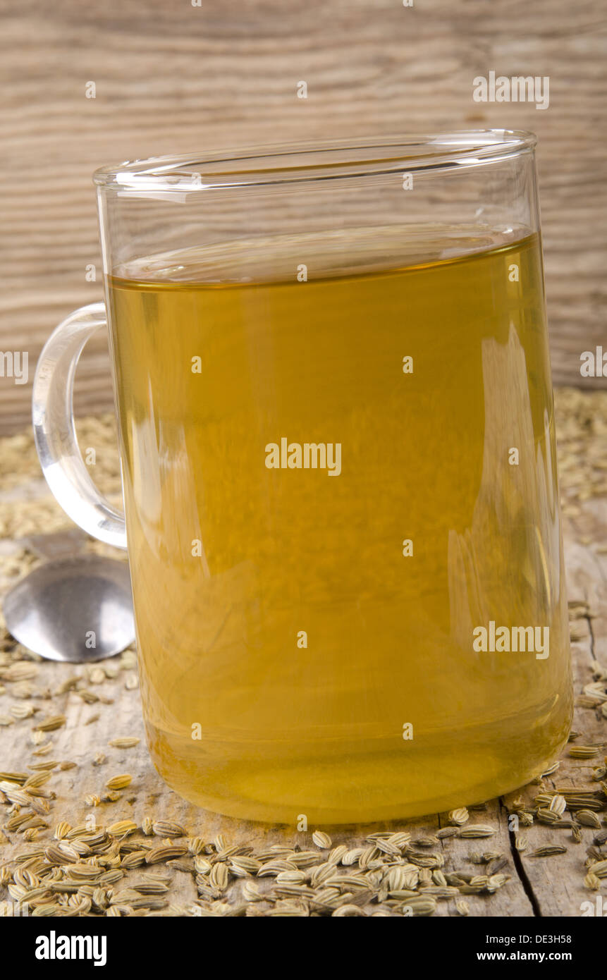 warm fennel tea in a glass and spoon Stock Photo - Alamy