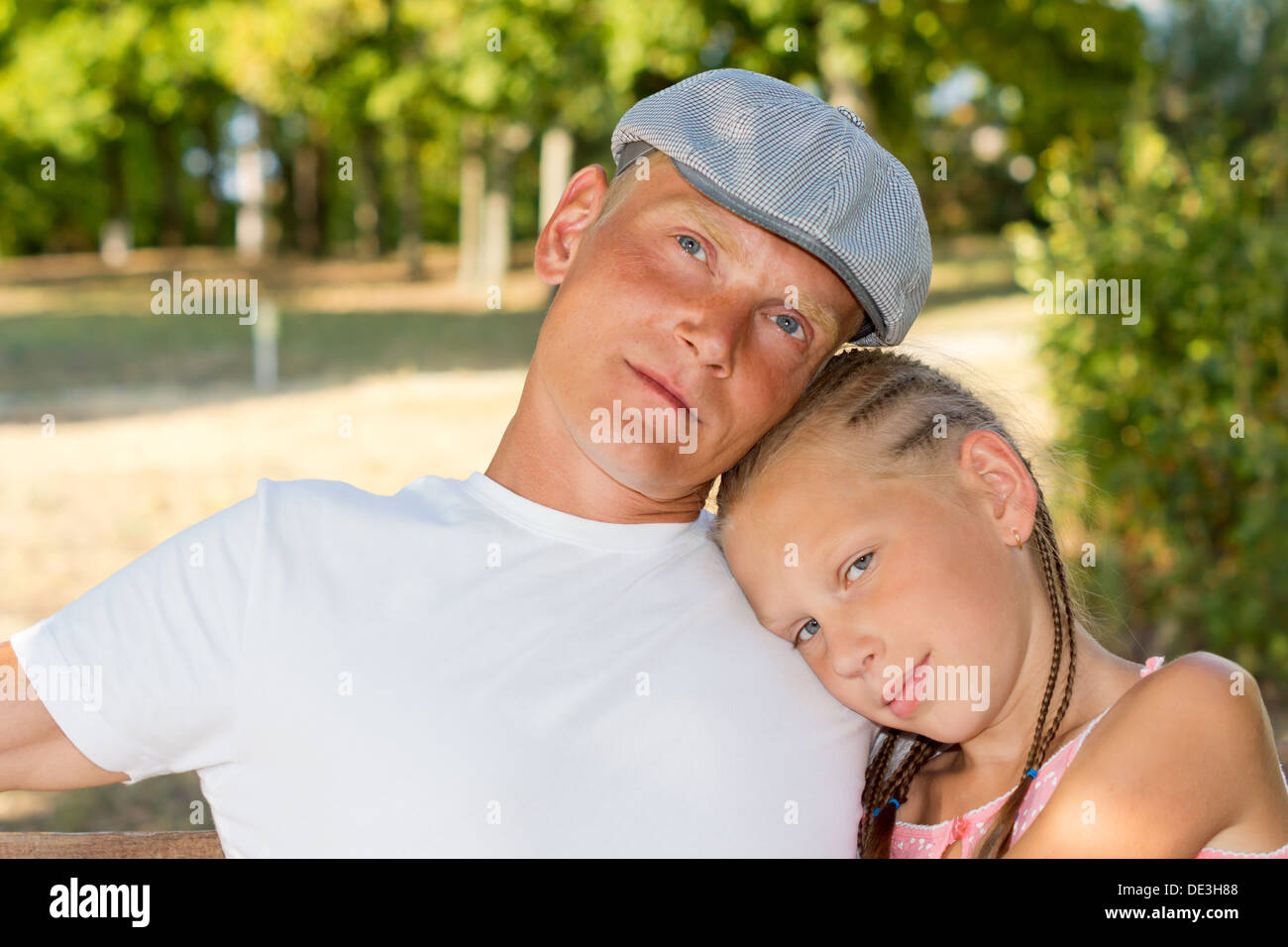 Horizontal family portrait of a Caucasian middle-aged man next to his ...