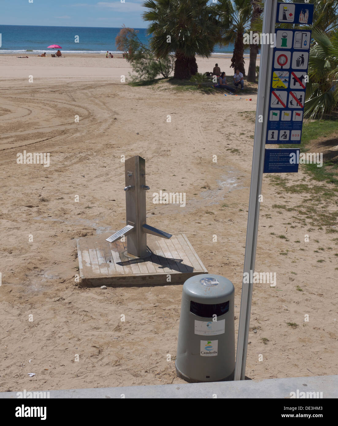 Tap to clean the sand off your feet with a trash can and information ...