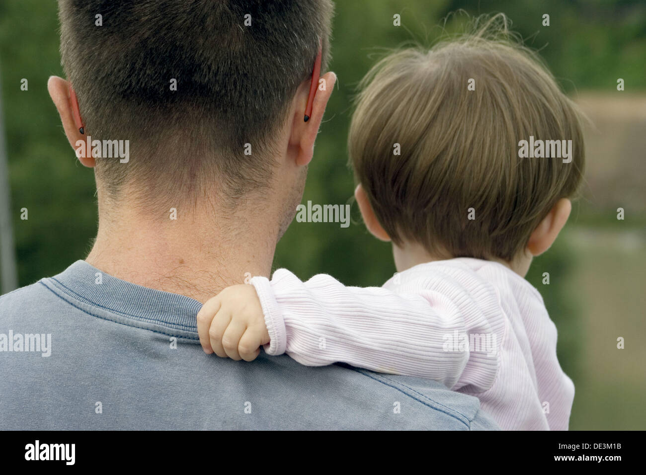 A man with his child Stock Photo - Alamy