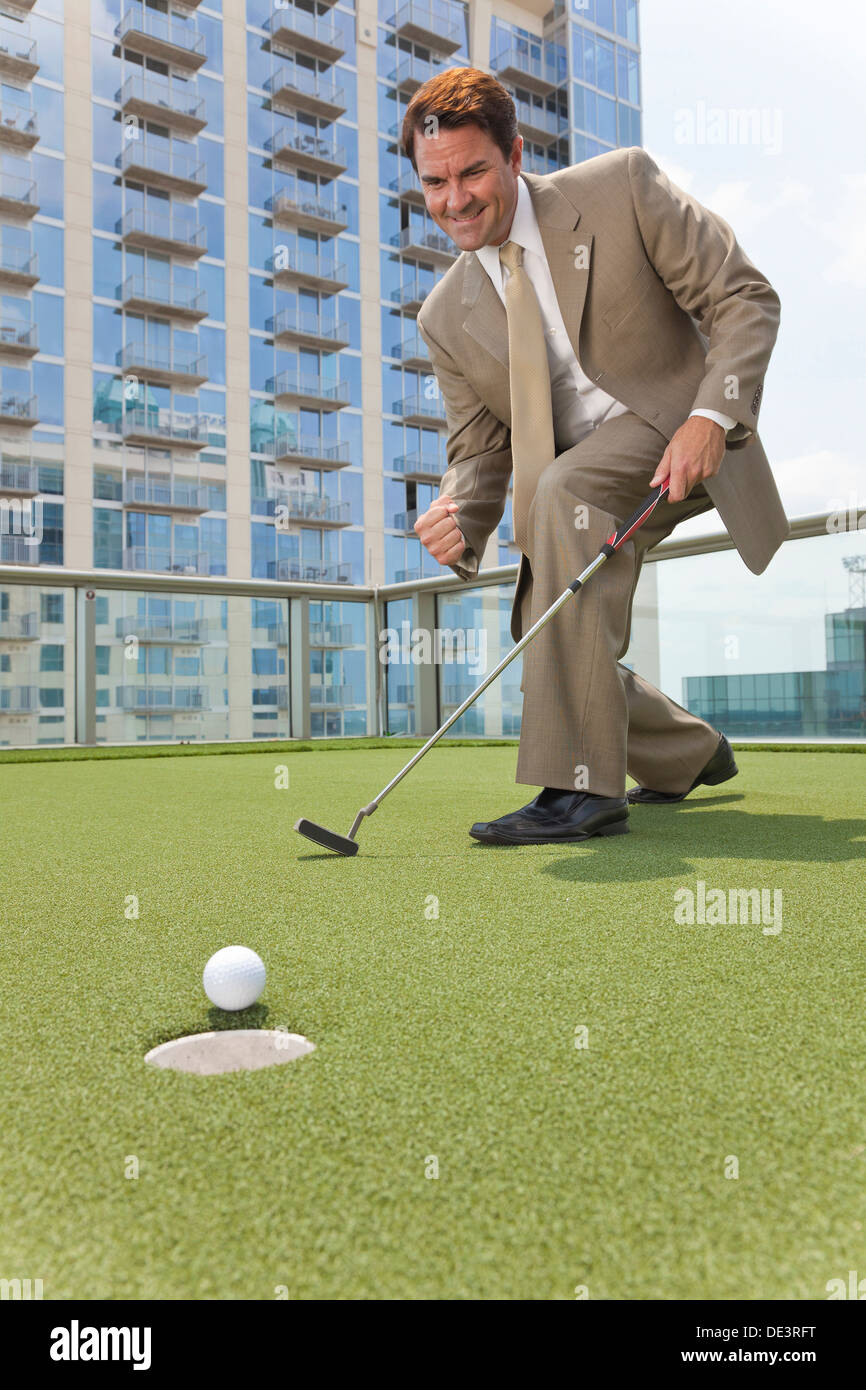 Business executive playing golf hi-res stock photography and images - Alamy