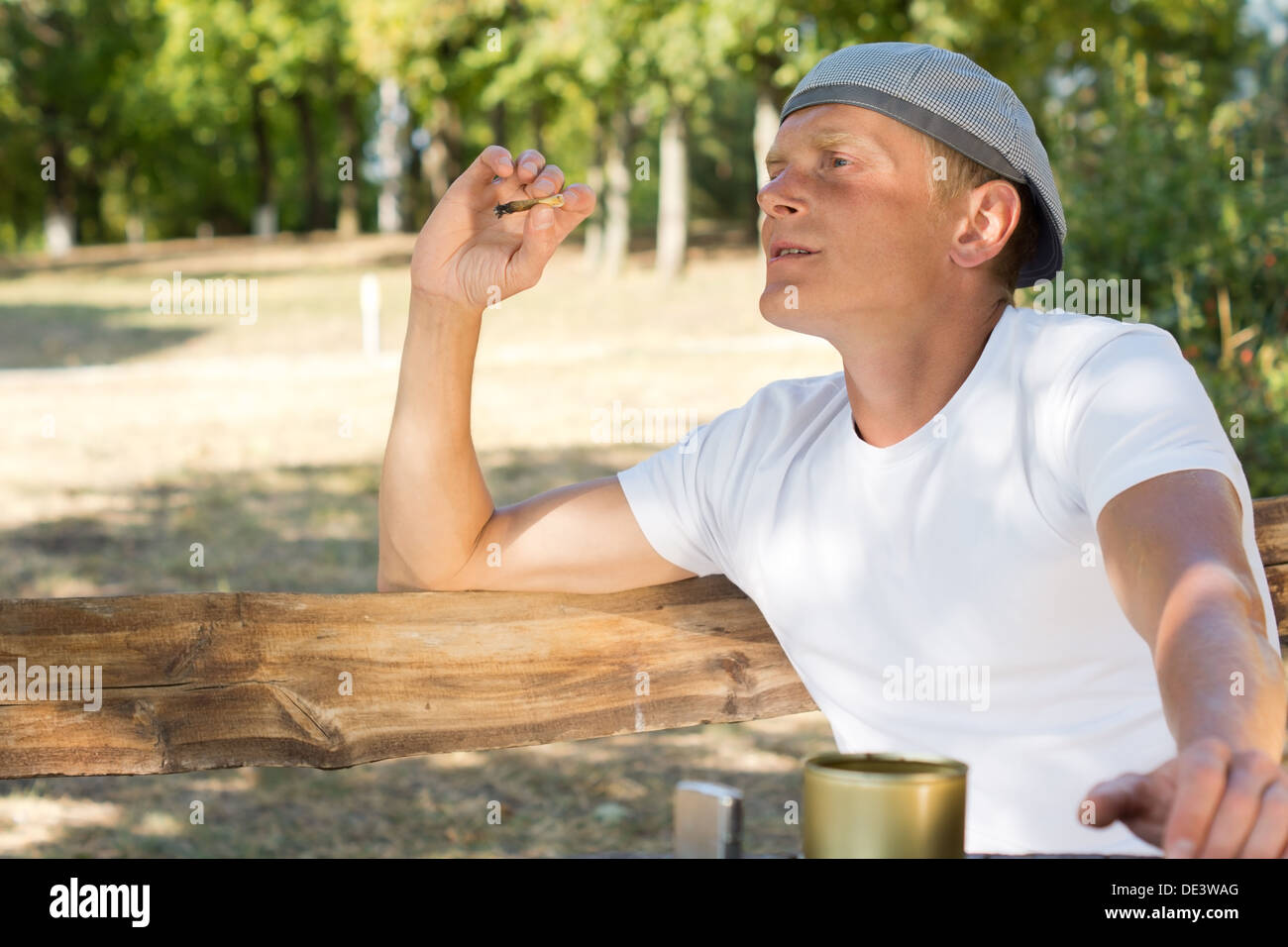 Man outdoors in park smoking hi-res stock photography and images - Alamy