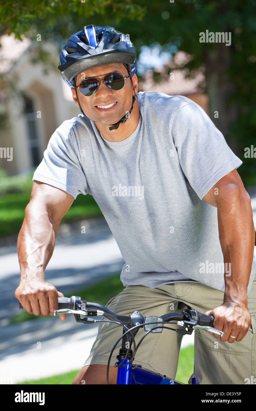 Black man riding a bike hi-res stock photography and images - Alamy