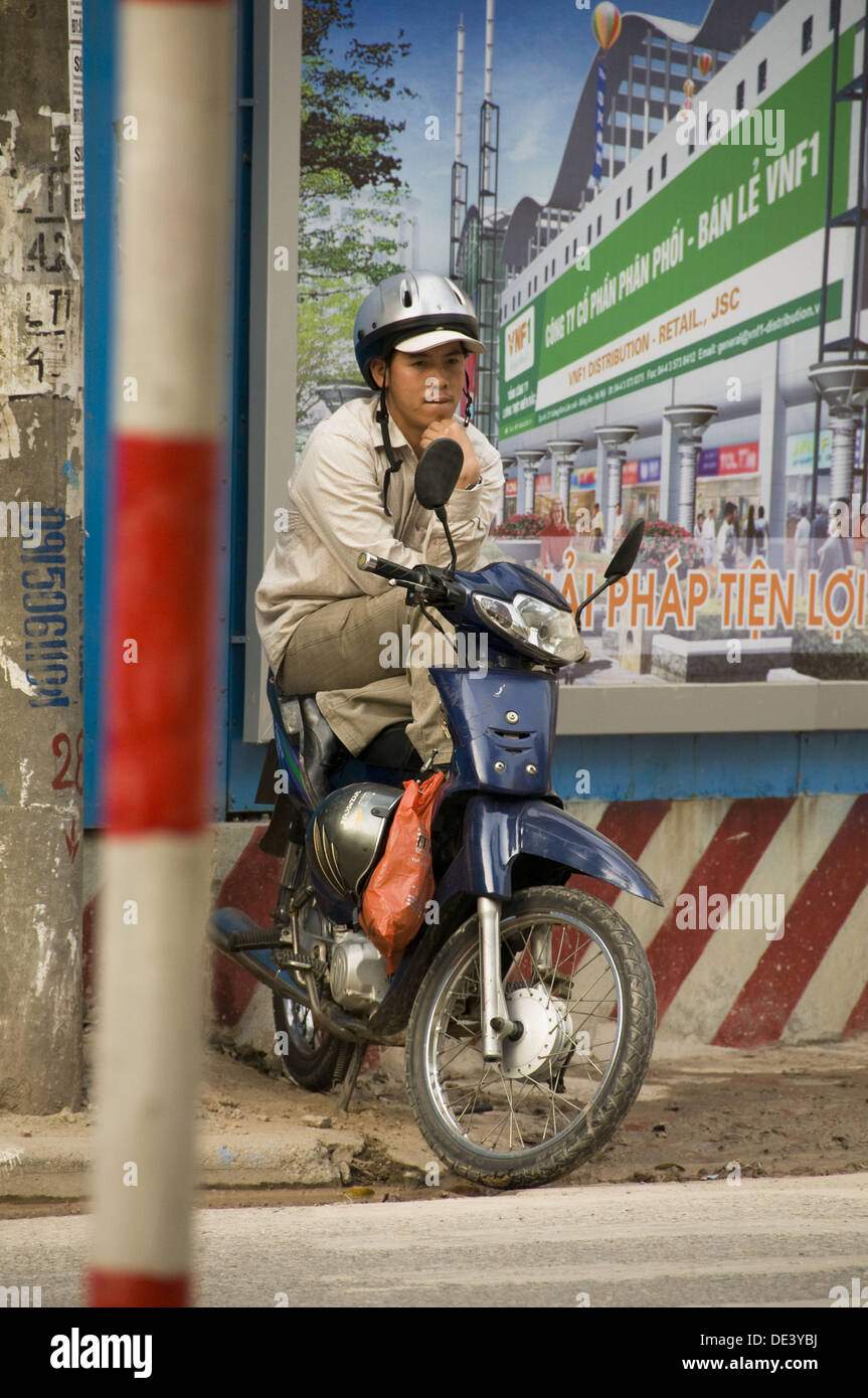 motorcycle taxi driver in front of a mural in Hanoi Vietnam Stock Photo ...