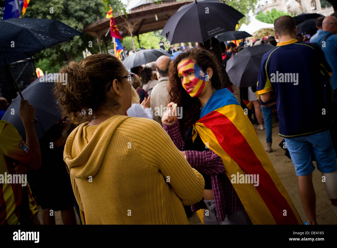 Barcelona, Spain. 11th Sep, 2013. A girl with her face painted with the ...