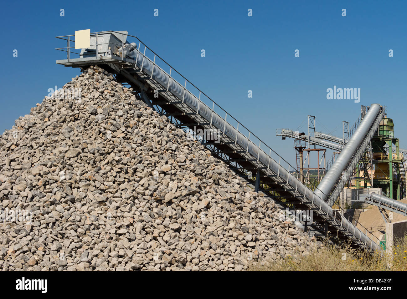 Open cast mining of stone for the construction industry with a ...