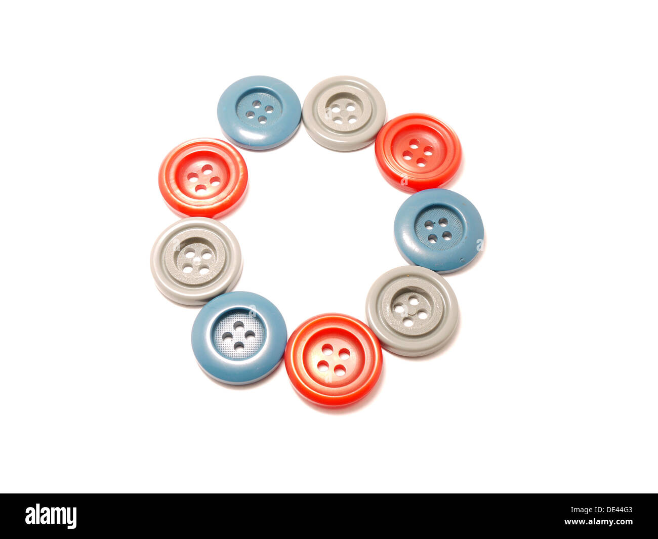 Letter "O" from buttons on a white background Stock Photo - Alamy